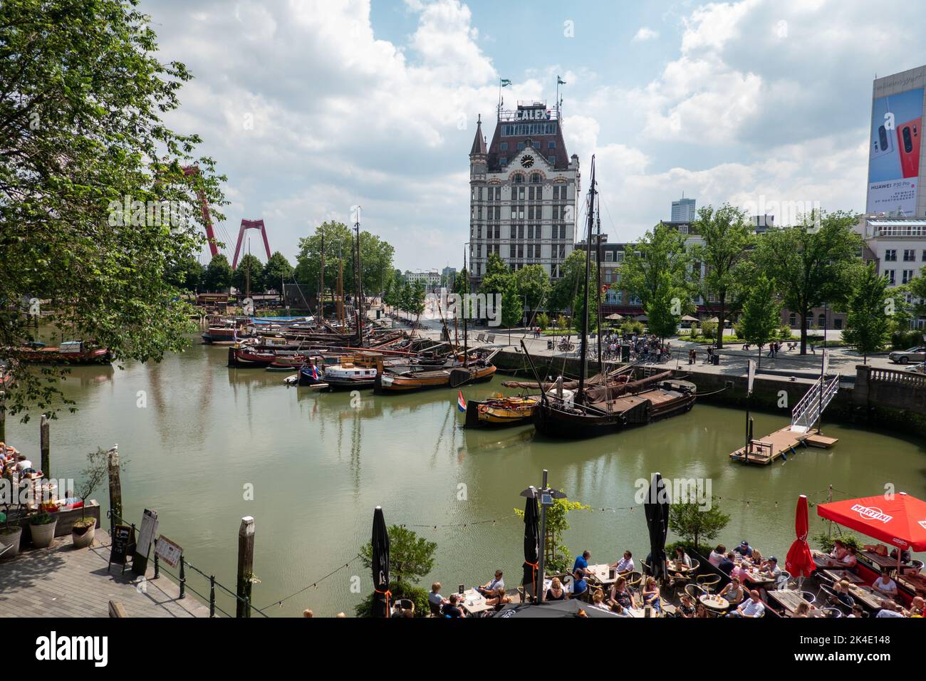 A high-angle of 'Old Canals' of Rotterdam port with boats and ships a ...