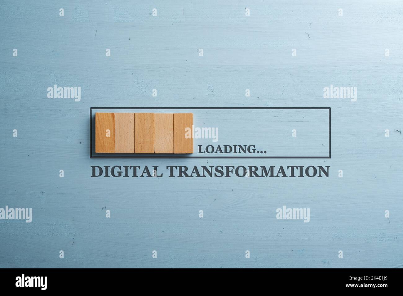 Progress bar cut into a blue wooden background with wooden blocks ...