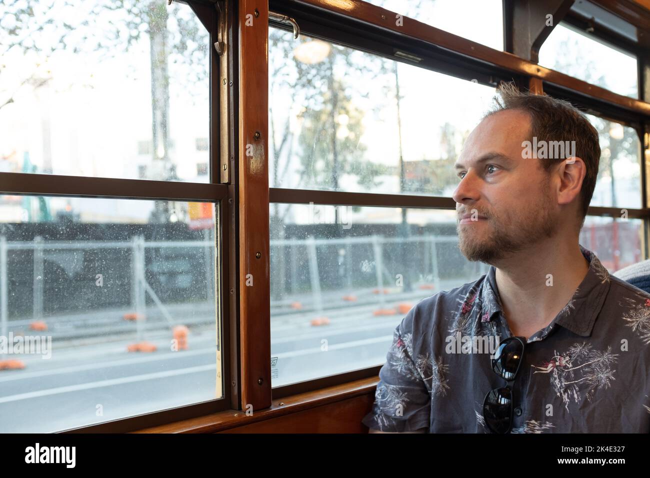A man sitting in a famous historic Melbourne W Class tram looking out ...