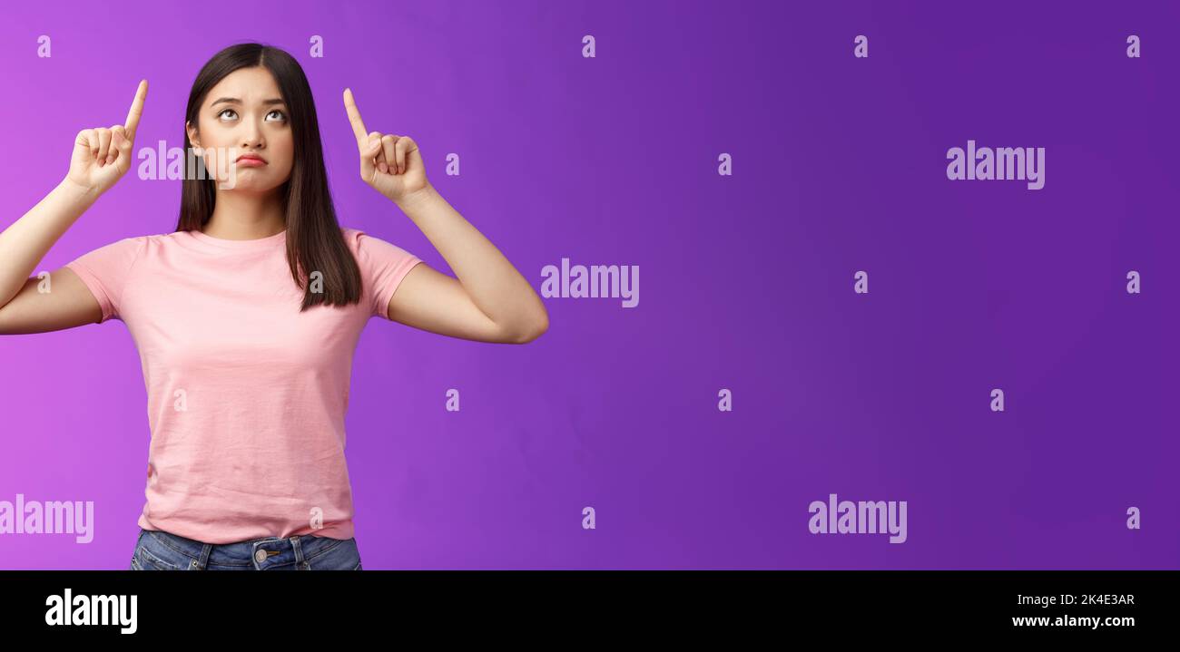 Sad disappointed sulking asian girl with short dark haircut, look ...