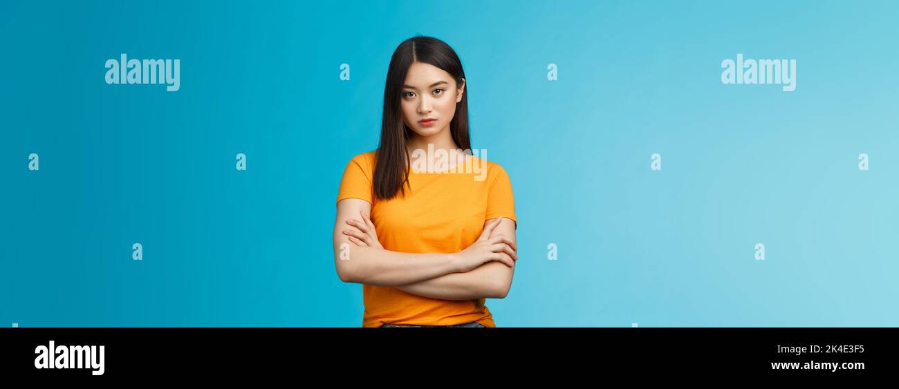 Serious-looking confident and arrogant asian woman cross hands chest ...