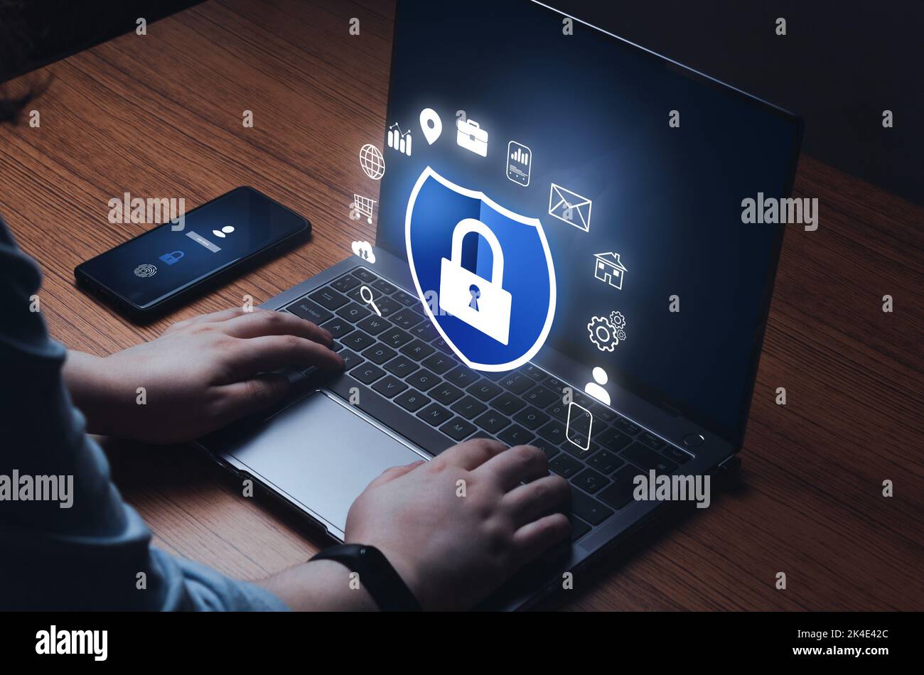 Woman checking laptop with digital security interface. Internet of ...