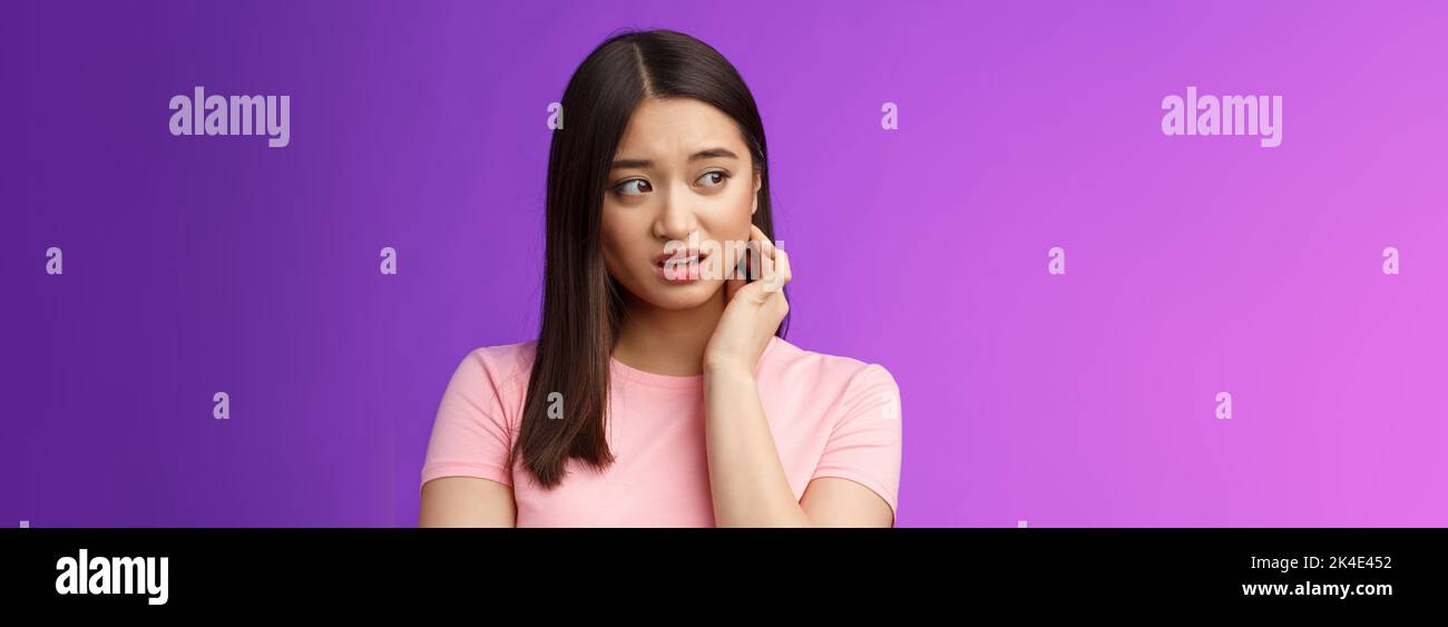 Insecure anxious young timid asian girl feel nervous scared, scratch ...