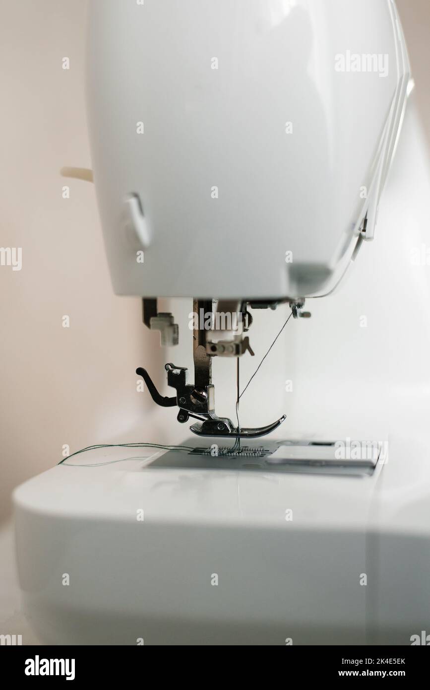 Close-up of sewing machine parts, needle and thread Stock Photo - Alamy