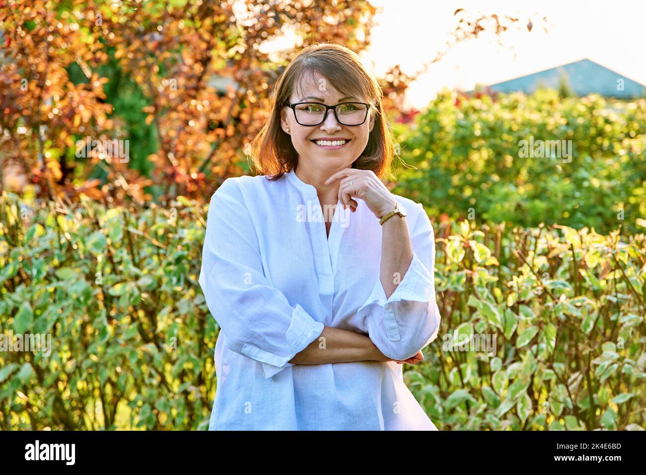 Outdoor portrait of happy woman 45 years old, looking at camera Stock ...