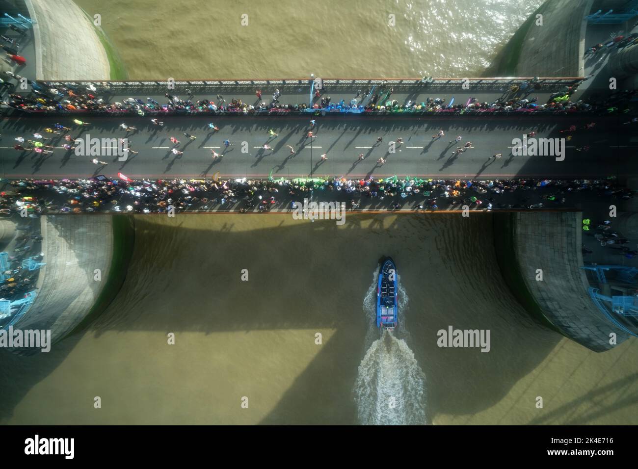 Runners cross Tower Bridge during the TCS London Marathon. Picture date ...