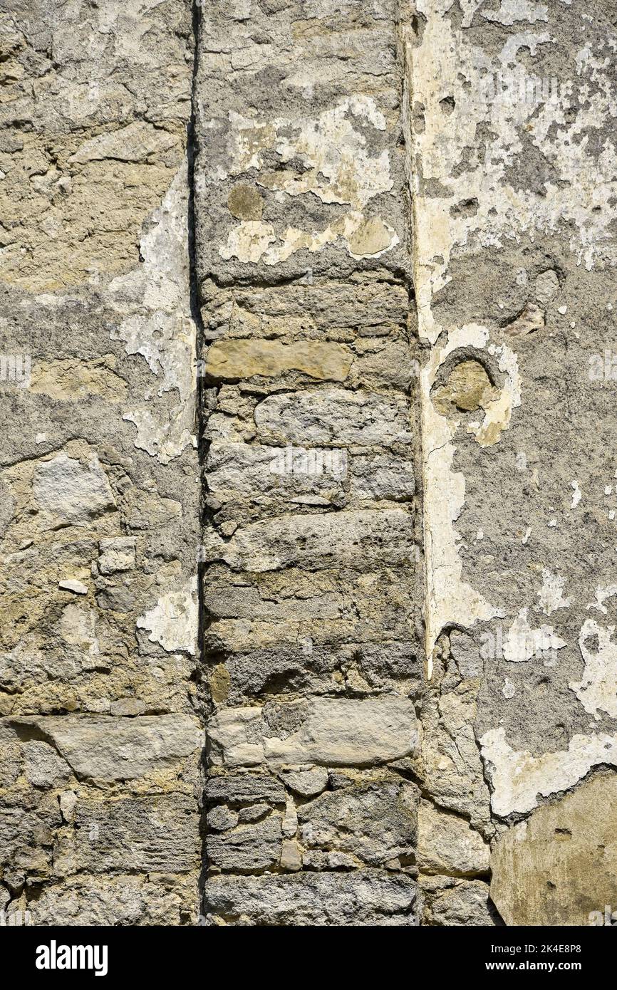 Texture of wall of old building with collapsed plaster, cracks and ...