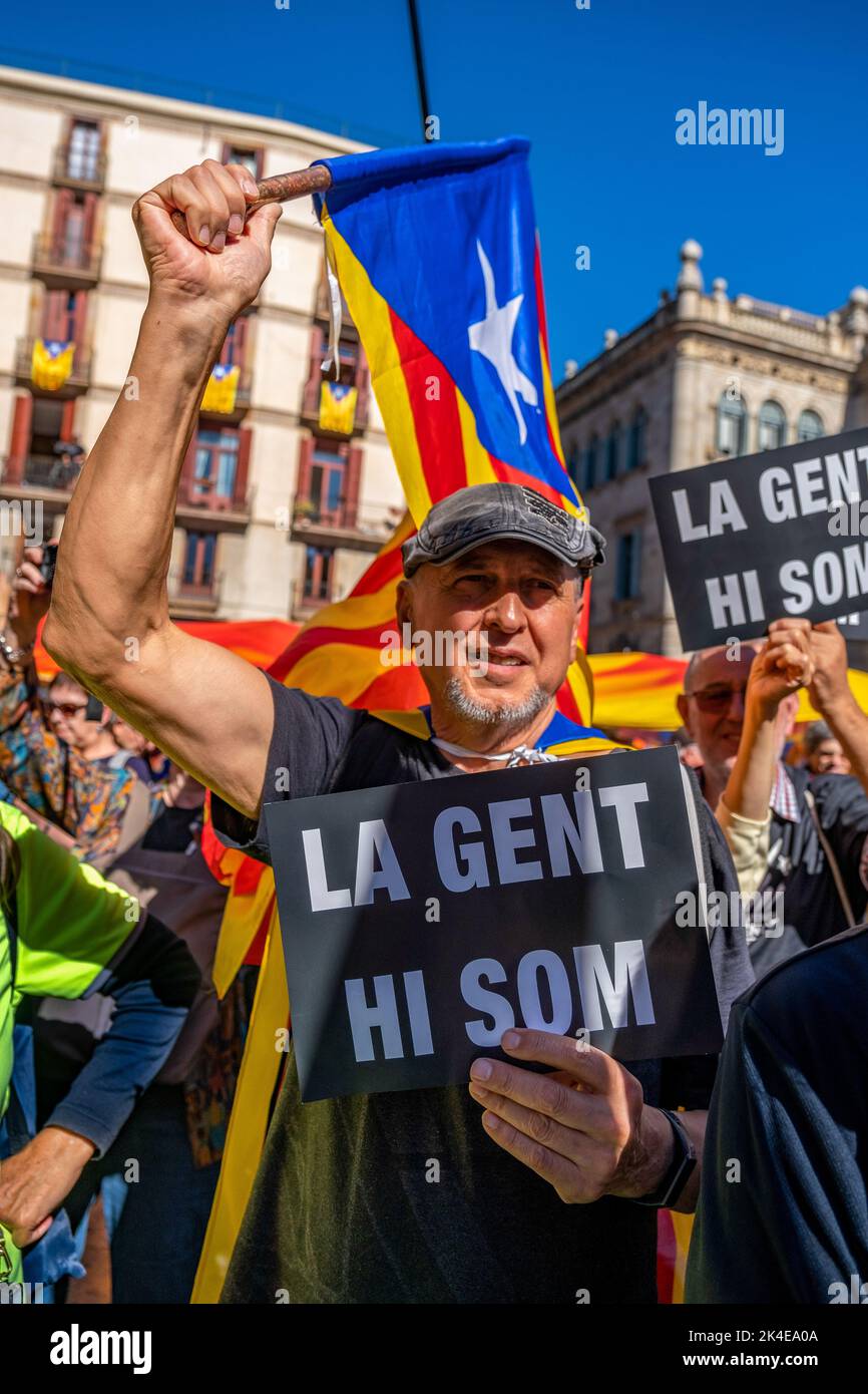 Pro-independence protesters are seen displaying placards and flags in ...