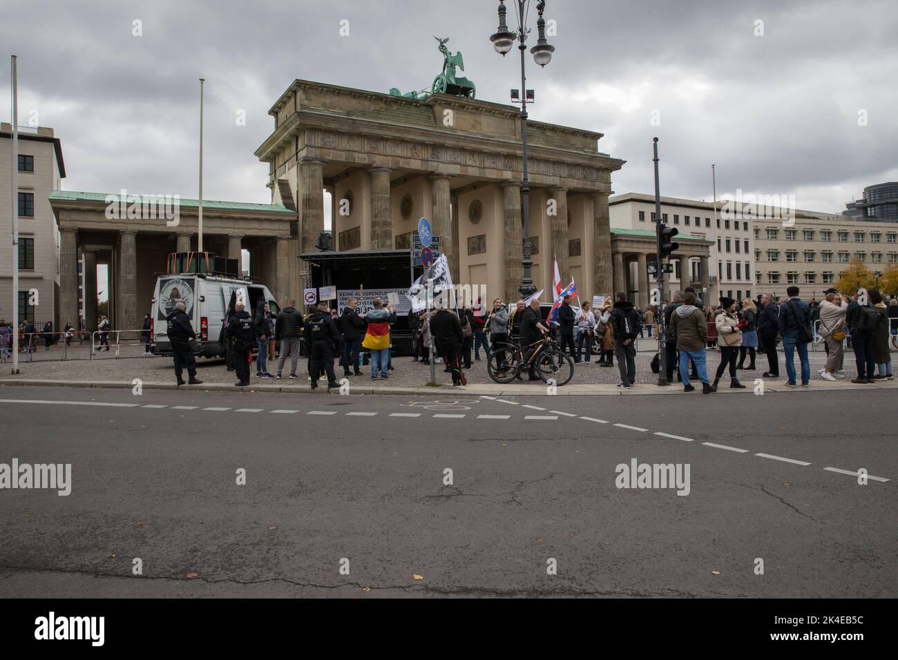 Protesters gathered at a rally in front of the Brandenburg Gate in ...