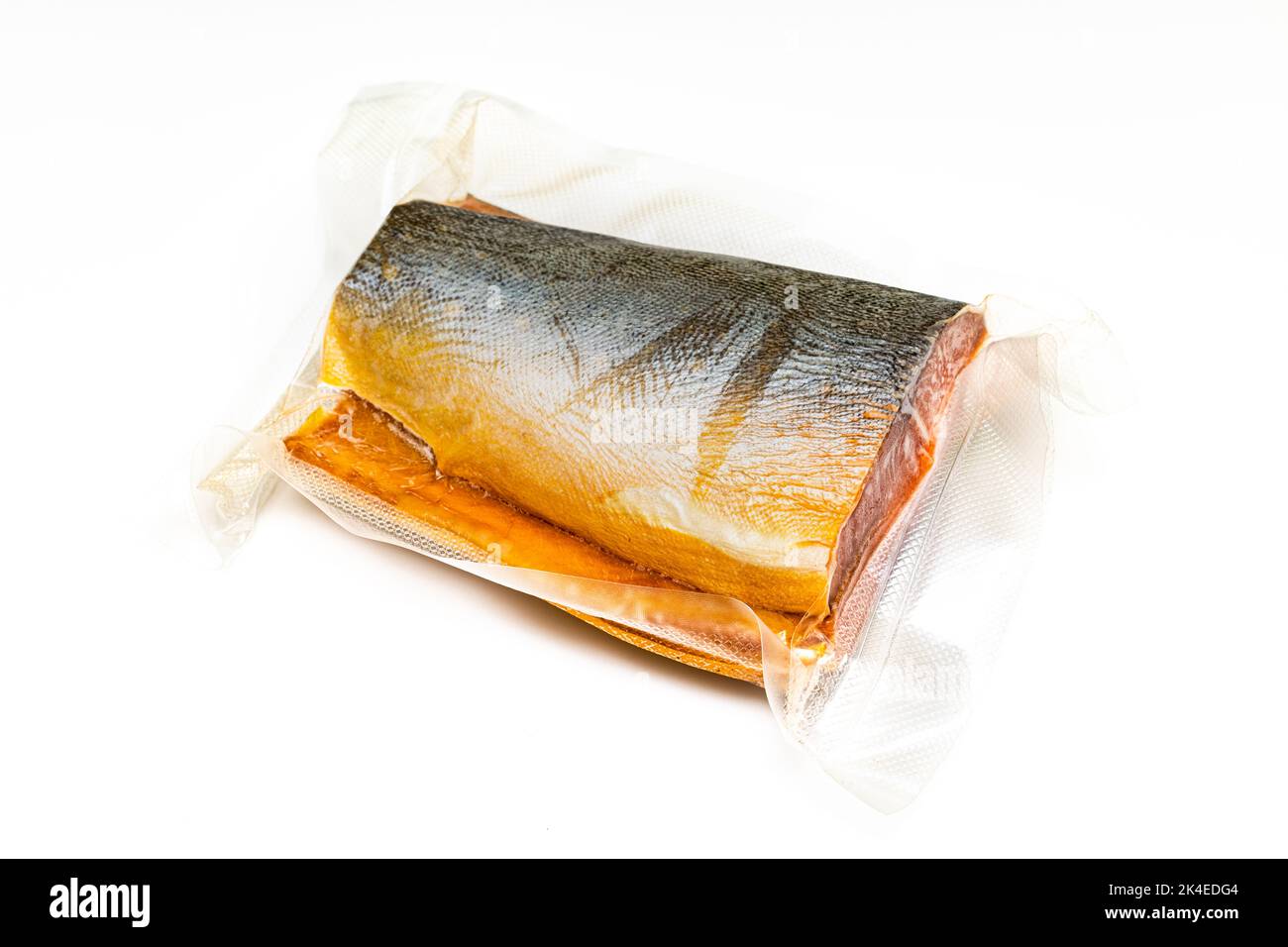 red fish in a transparent package on a white background. High quality ...