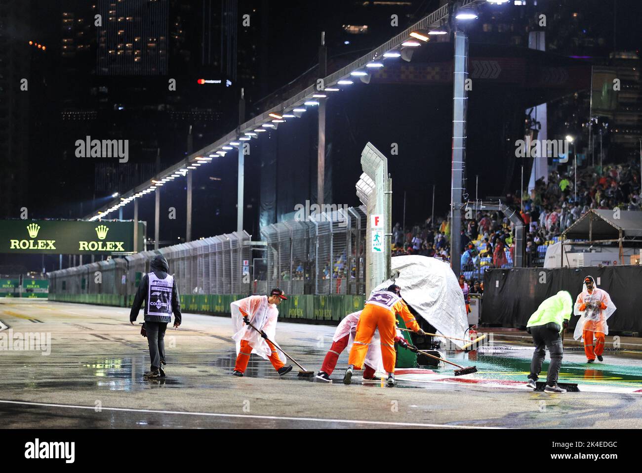Singapore, Singapore. 02nd Oct, 2022. Circuit atmosphere - marshals sweep the circuit of rain ...