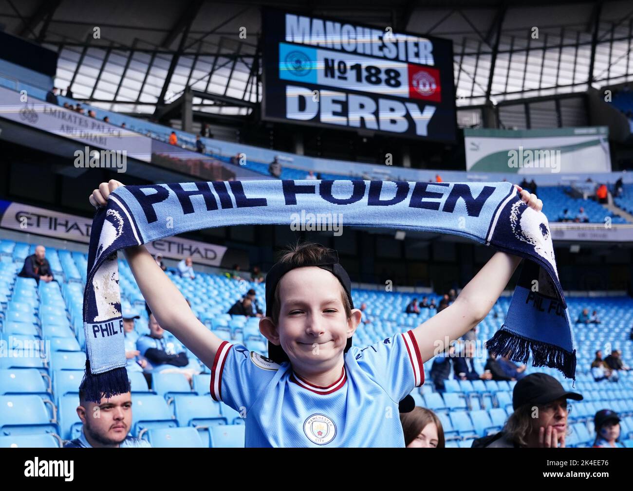 A Manchester City fan holds up a Phil Foden scarf ahead of the Premier ...