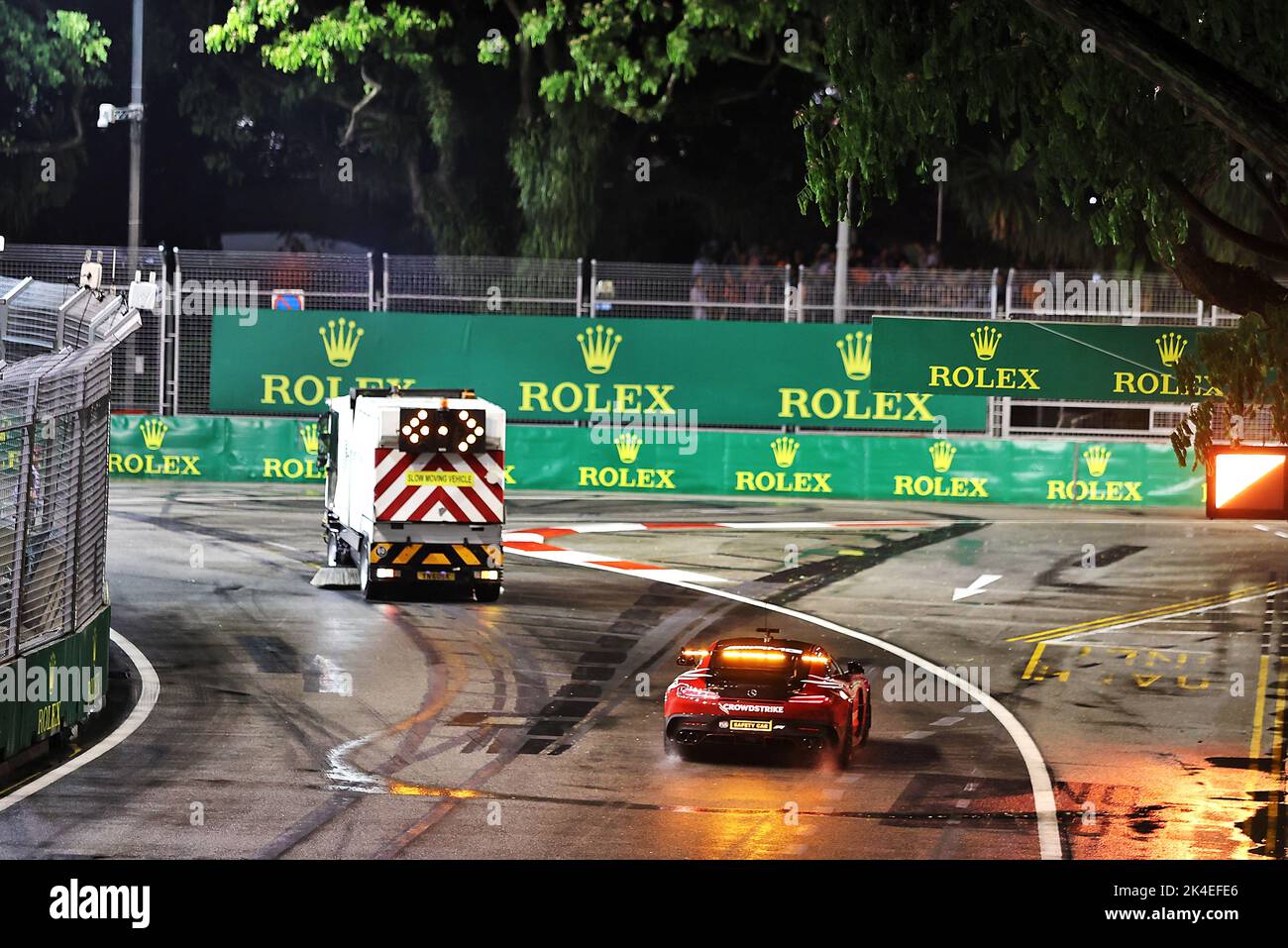 Singapore, Singapore. 02nd Oct, 2022. Circuit atmosphere - marshals sweep the circuit of rain ...