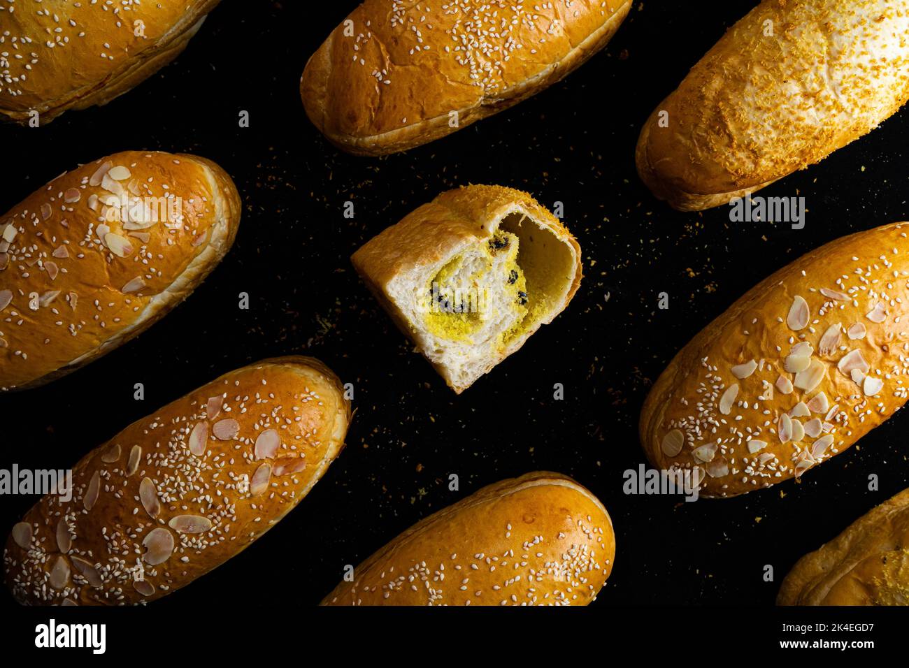 A top view of bread loaves covered in sesame seeds and peanuts Stock ...