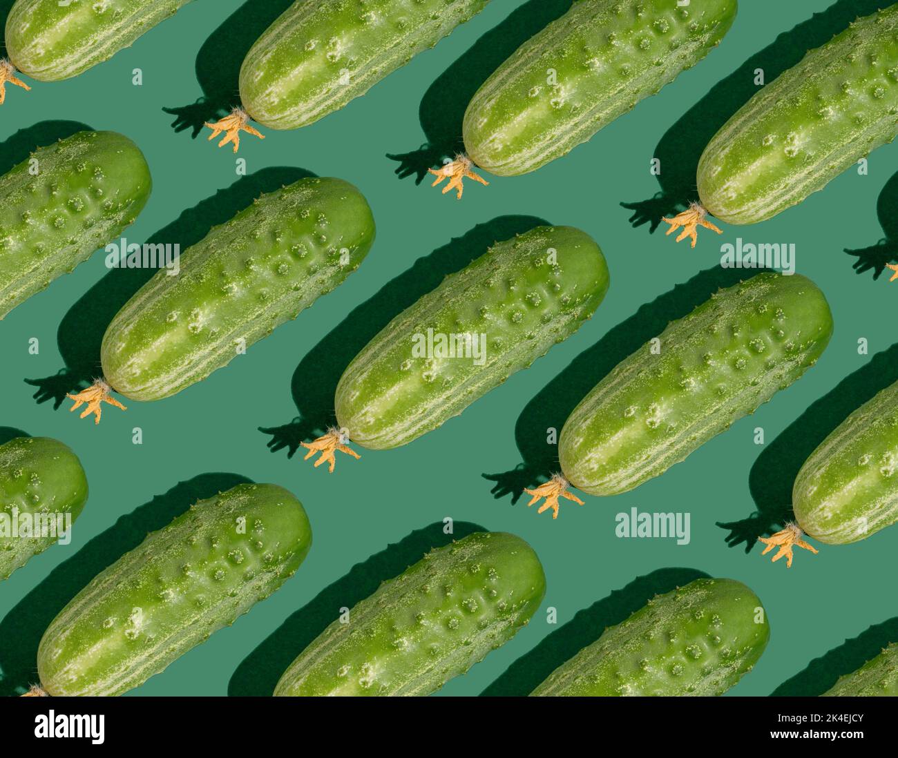 Cucumber pattern. Cucumbers on a green background. Vegetables food ...