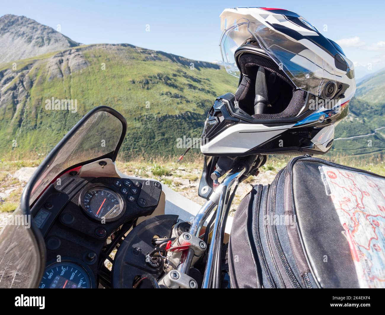 Tank bag with map on an adventure motorcycle at a mountain pass in the ...