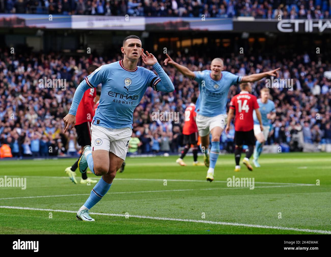 Manchester City's Phil Foden (left) celebrates scoring their side's ...