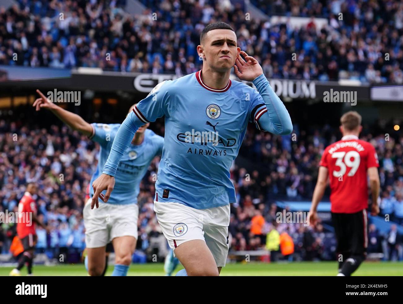 Manchester City's Phil Foden (left) celebrates scoring their side's ...