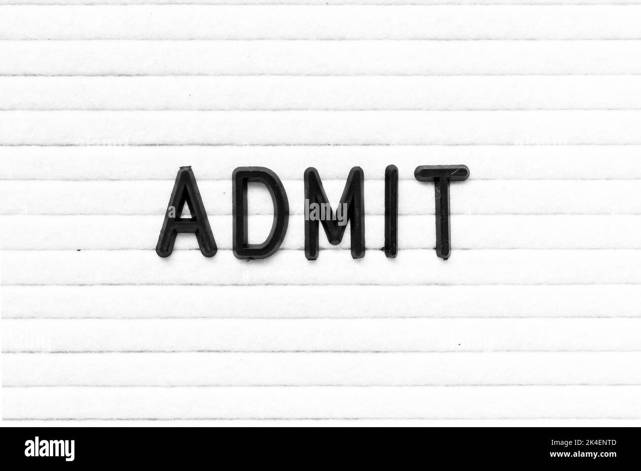 Black color letter in word admit on white felt board background Stock ...