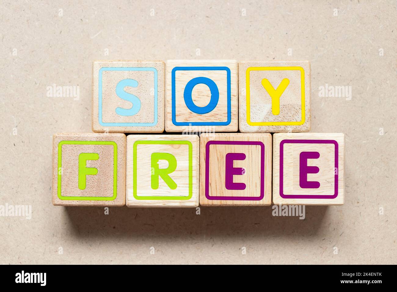 Color letter block in word soy free on wood background Stock Photo - Alamy