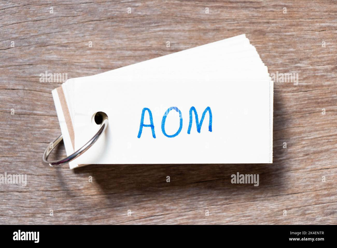 Flash card with handwriting in word AOM (Abbreviation of Advanced order ...