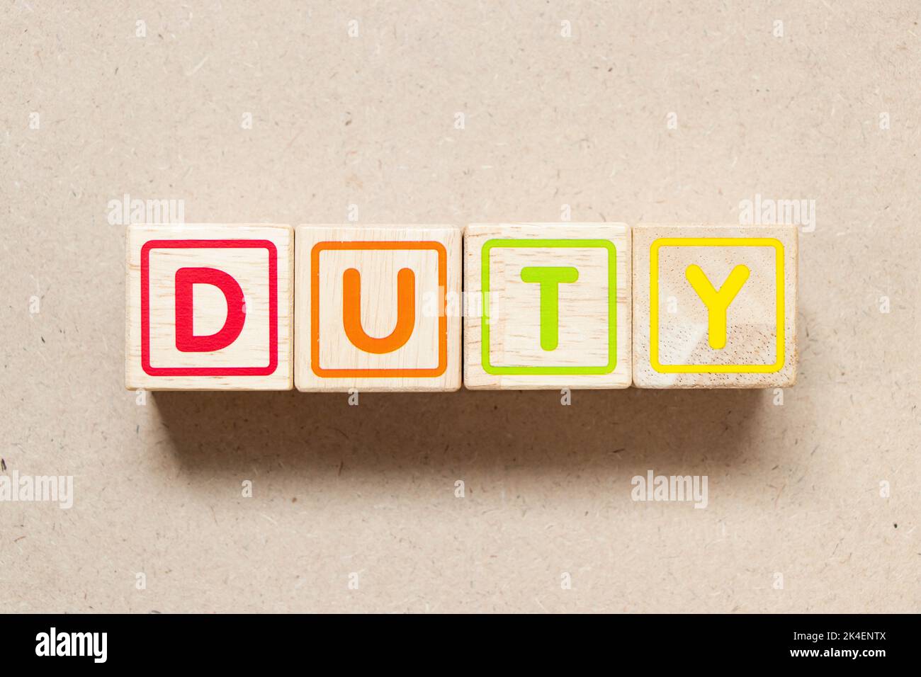 Color letter block in word duty on wood background Stock Photo - Alamy