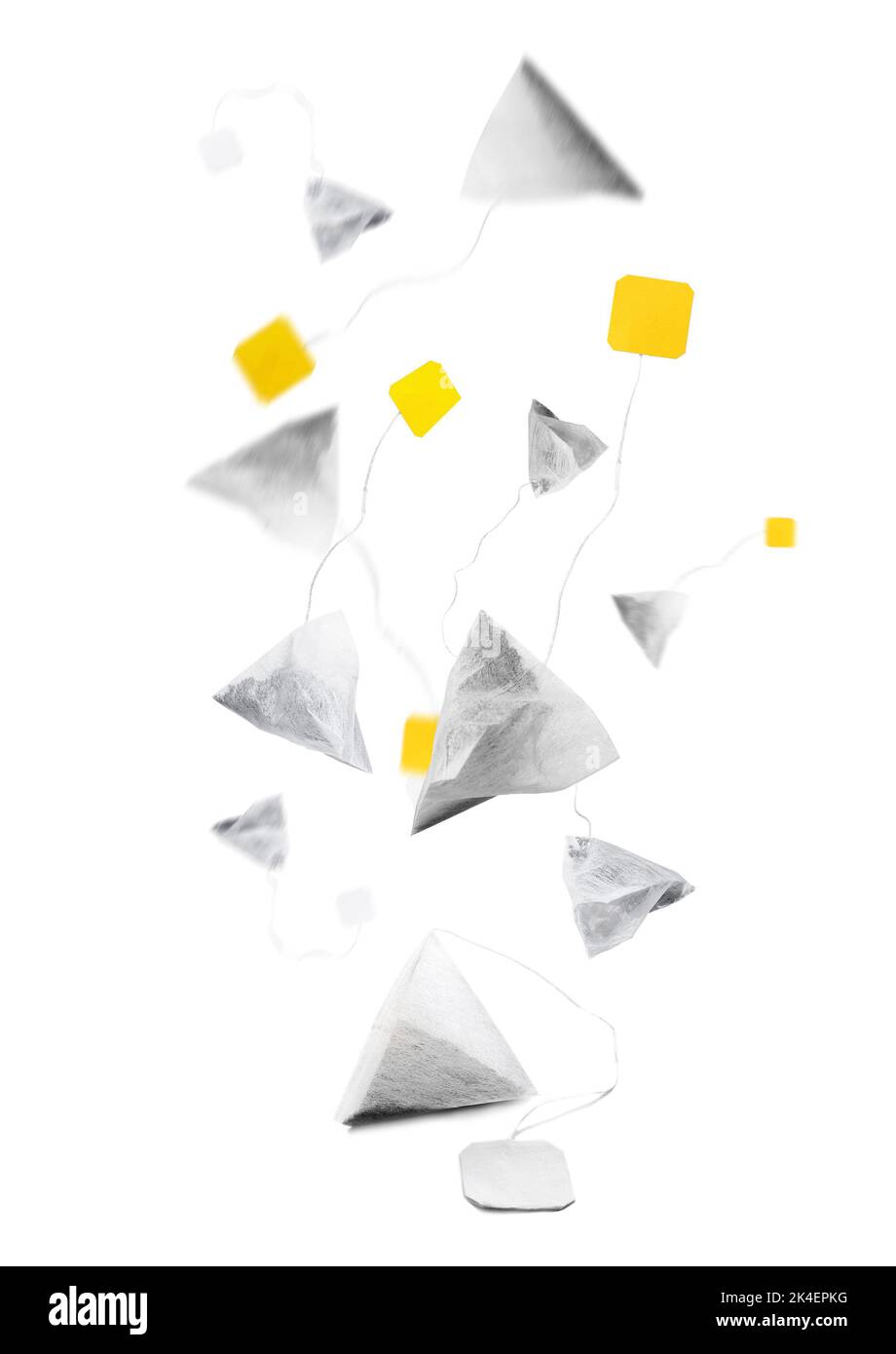 Many falling tea bags on white background Stock Photo - Alamy