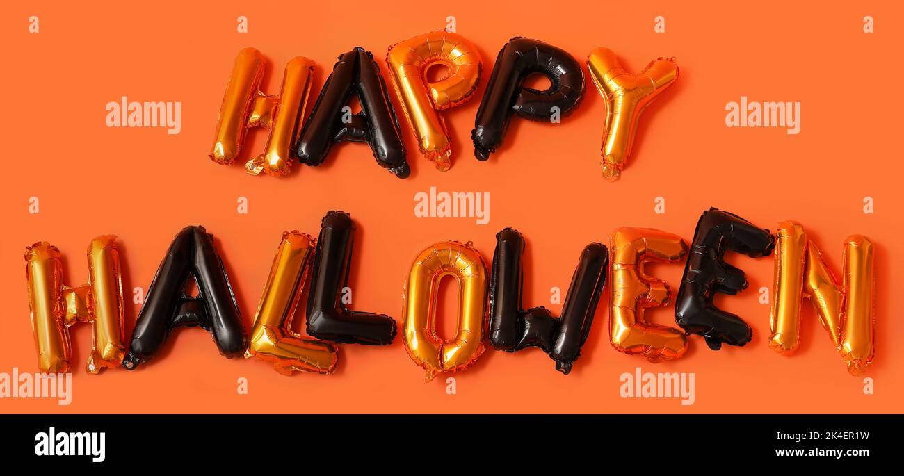 Text HAPPY HALLOWEEN made of balloons on orange background Stock Photo ...