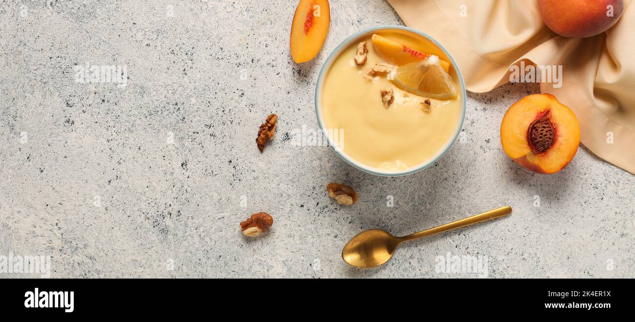 Bowl of delicious pudding with fruits on light background with space ...