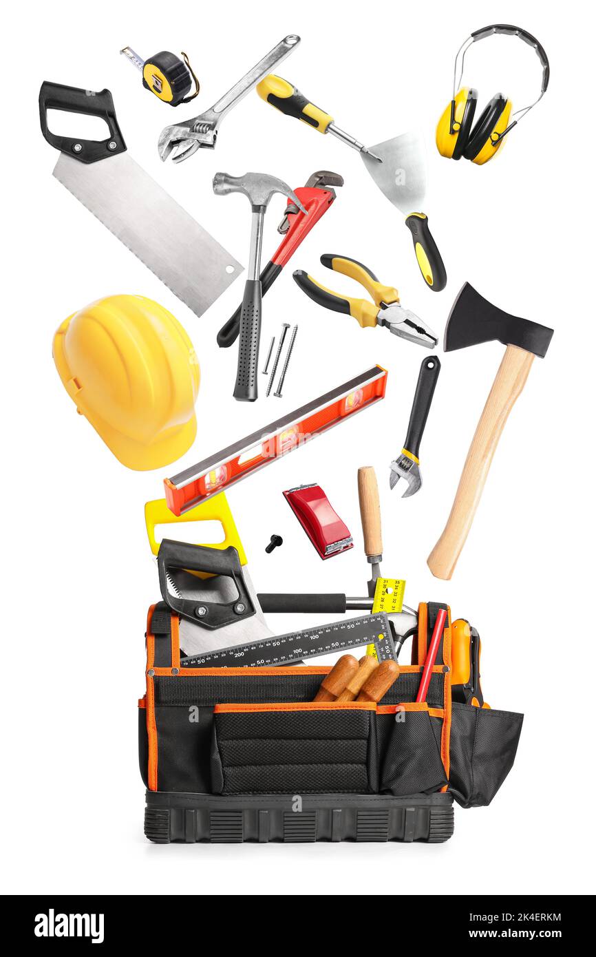 Bag with set of construction tools on white background Stock Photo - Alamy