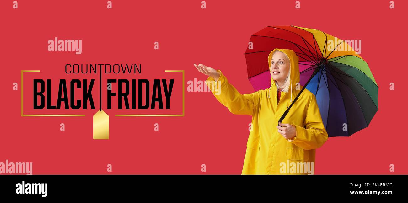 Beautiful mature woman in raincoat and with umbrella on red background ...