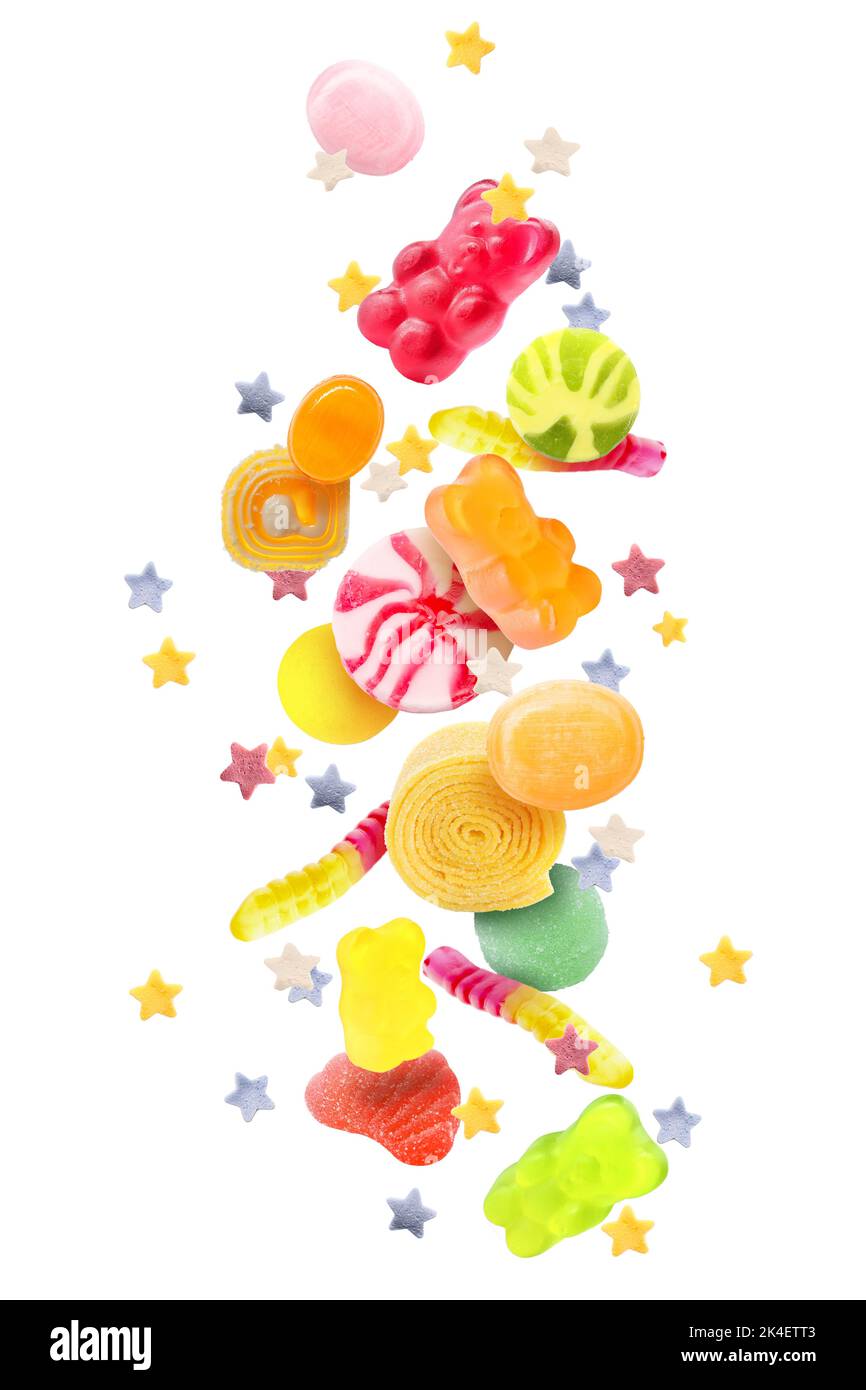 Many flying candies on white background Stock Photo - Alamy