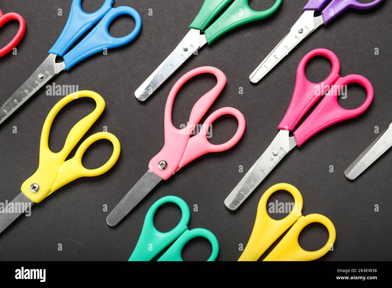 Different scissors on black background Stock Photo - Alamy