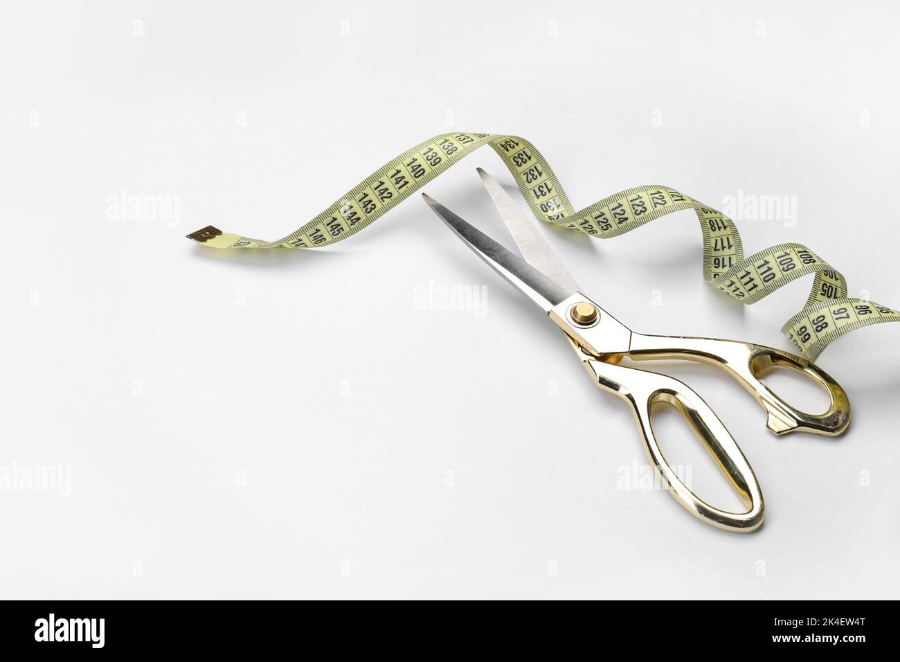 Scissors and measuring tape on white background Stock Photo - Alamy