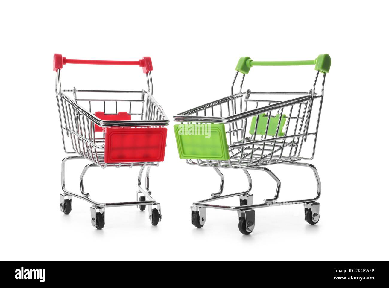 Empty red and green shopping carts on white background Stock Photo - Alamy