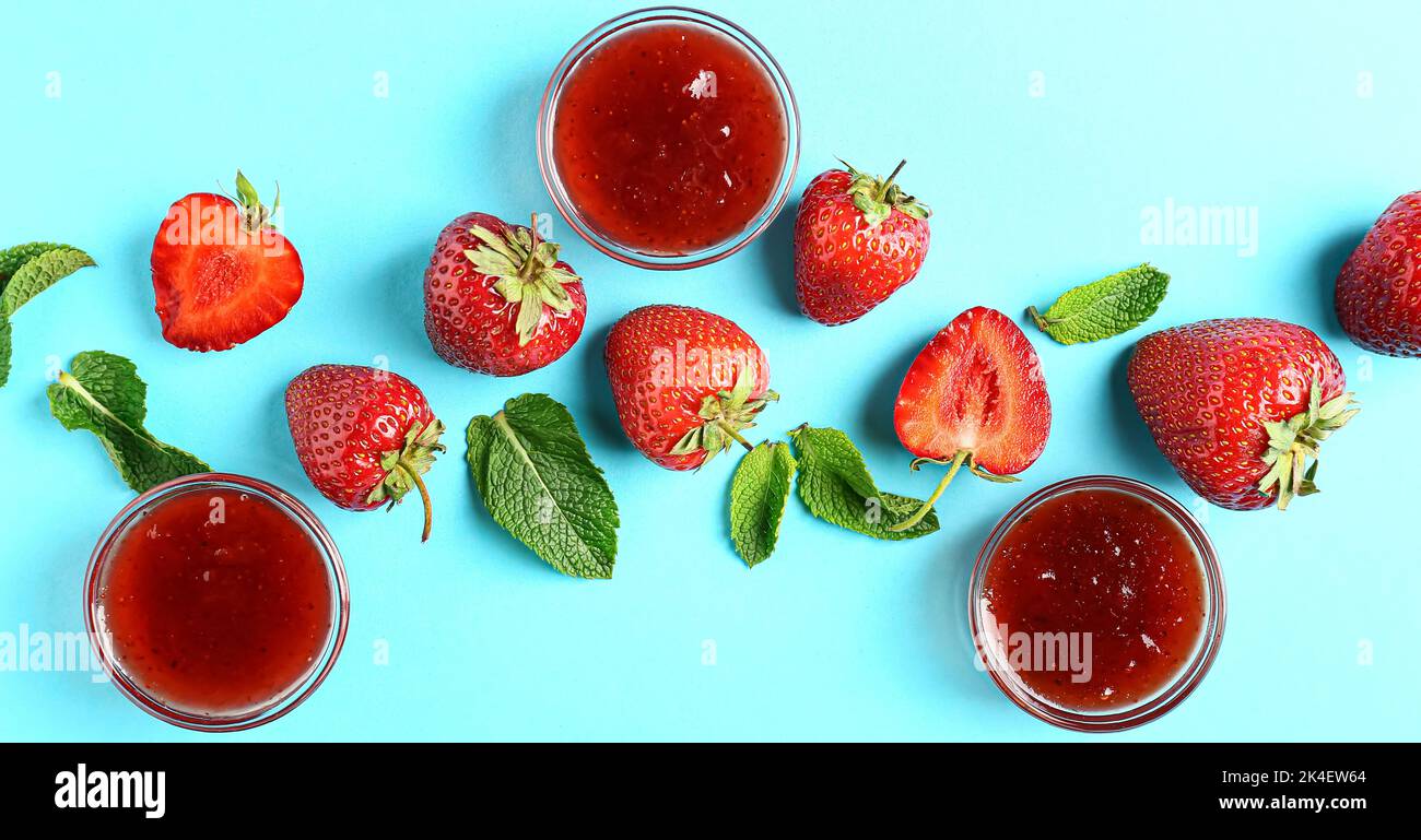 Composition with tasty strawberry jam on light blue background Stock ...