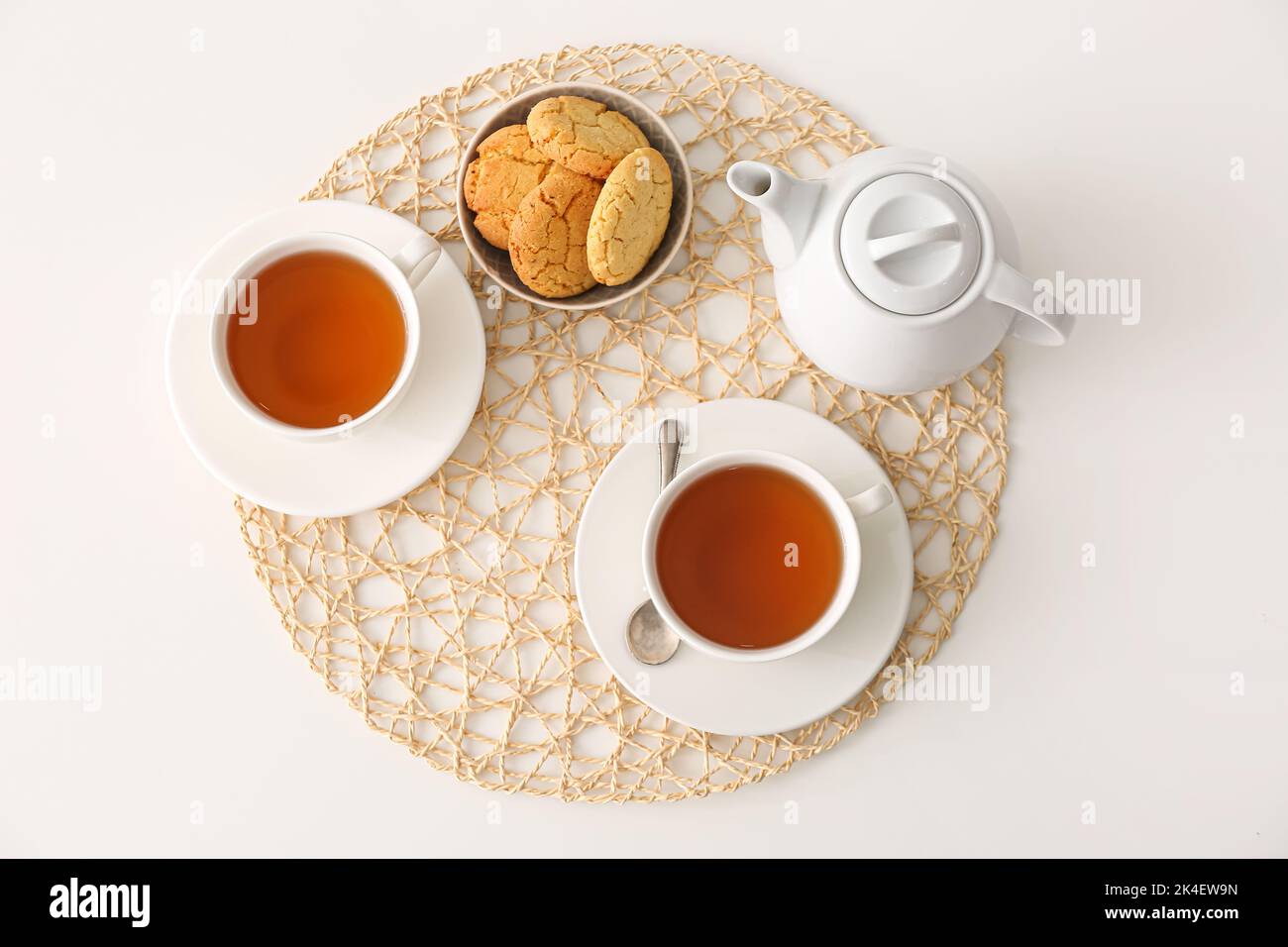 Cups of hot tea and pot on white background Stock Photo - Alamy