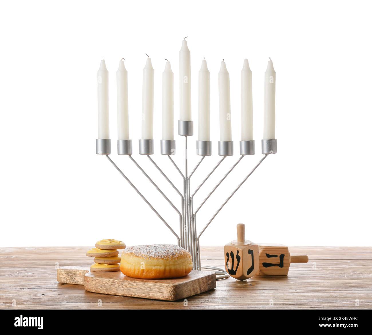 Menorah with candles, dreidels, donut and cookies for Hanukkah ...