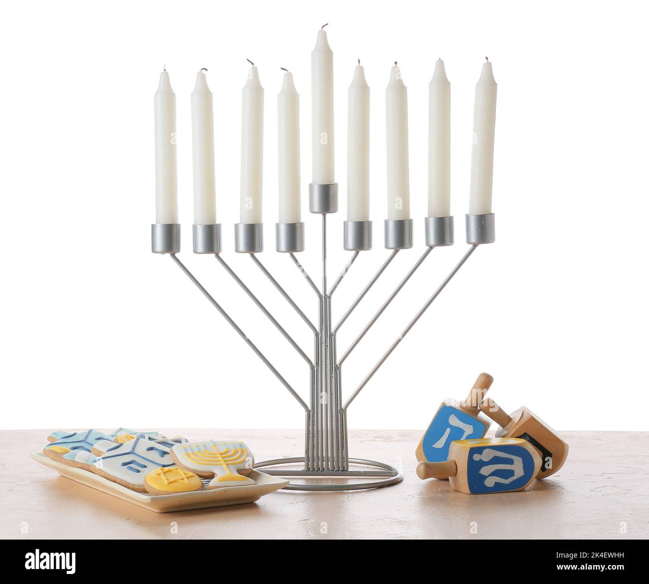 Menorah with candles, cookies and dreidels for Hanukkah celebration on ...