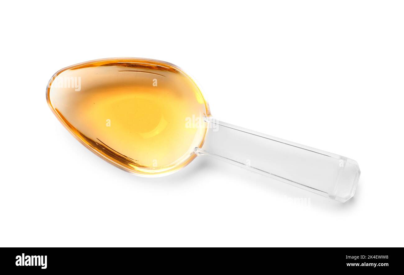 Spoon of cough syrup on white background Stock Photo - Alamy