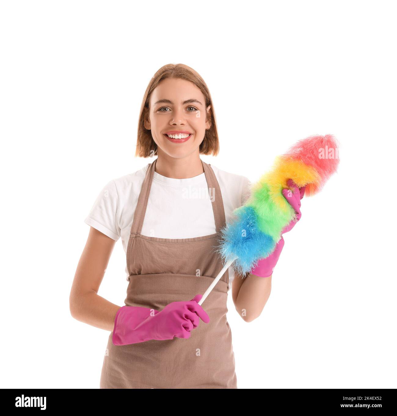 Pretty woman with duster on white background Stock Photo - Alamy