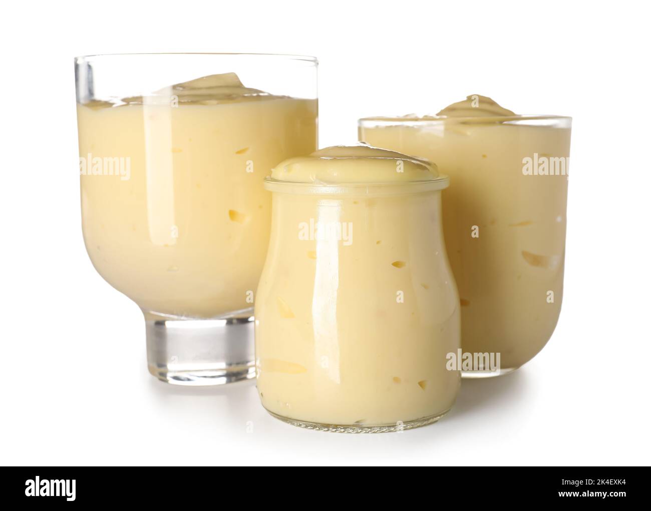 Glass containers of tasty vanilla pudding on white background Stock ...