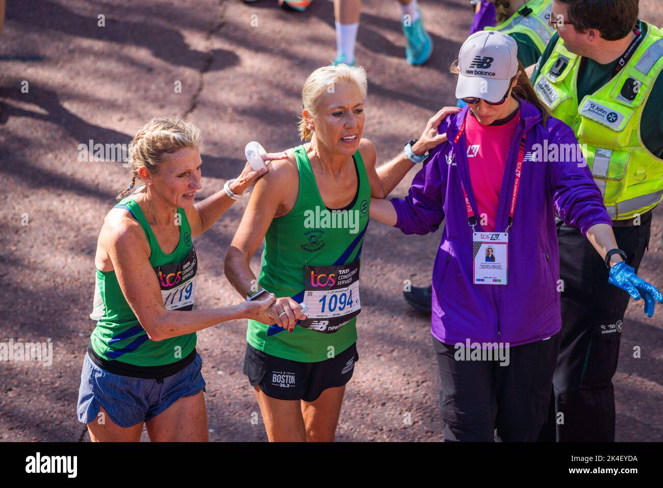 London UK. 2 October 2022 . A marathon runner is helped by paramedics ...