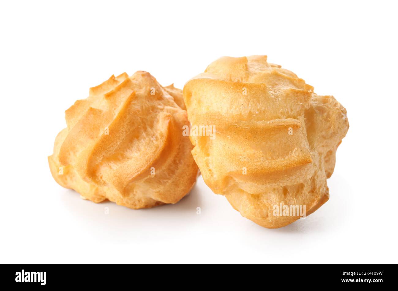 Tasty round eclairs on white background Stock Photo - Alamy