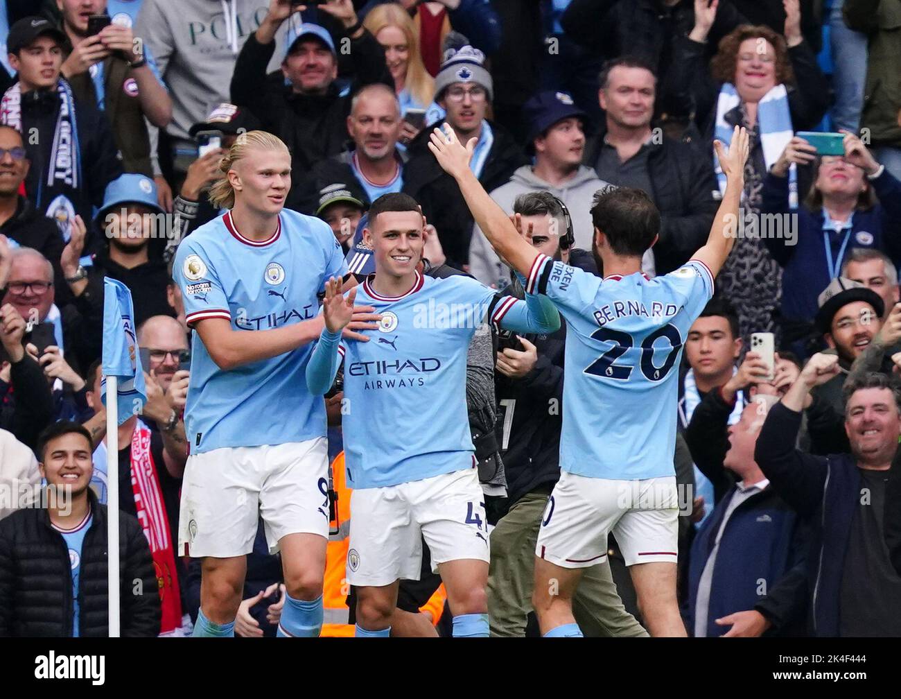 Manchester City's Phil Foden (centre) celebrates scoring their side's ...