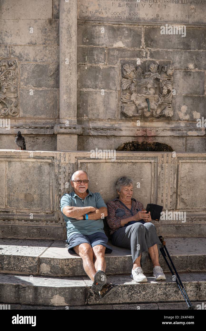 Tourists enjoy sunny and warm weather in old town of Dubrovnik, Croatia ...