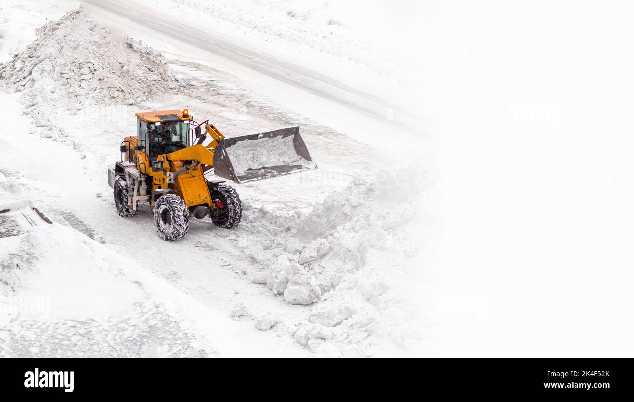 Tractor shovel removes snow municipal hi-res stock photography and ...