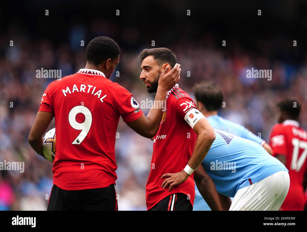 Manchester United's Anthony Martial consoles Bruno Fernandes following ...