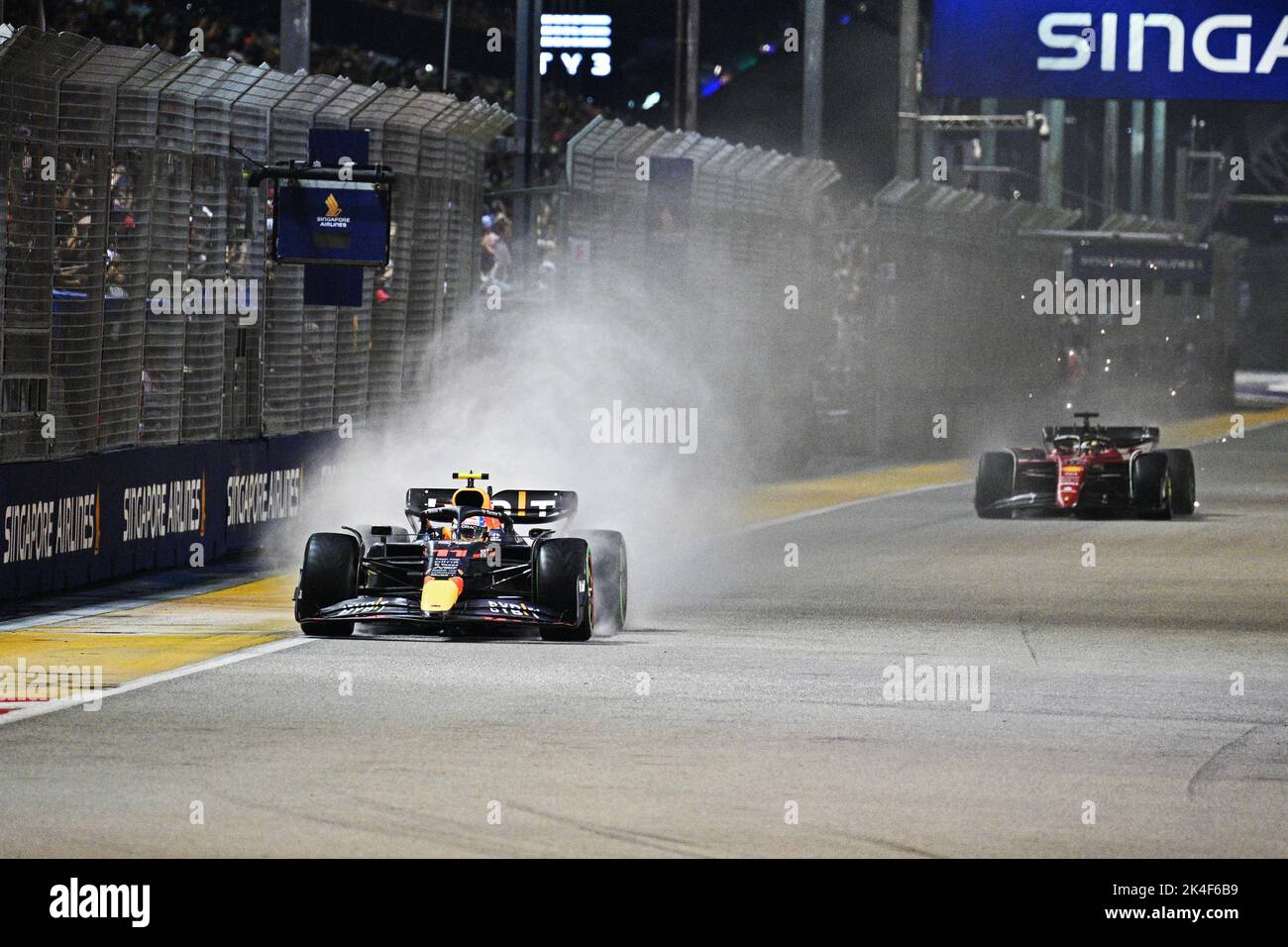 Singapore. 2nd Oct, 2022. Red Bull's Mexican driver Sergio Perez (L) drives during the Formula ...