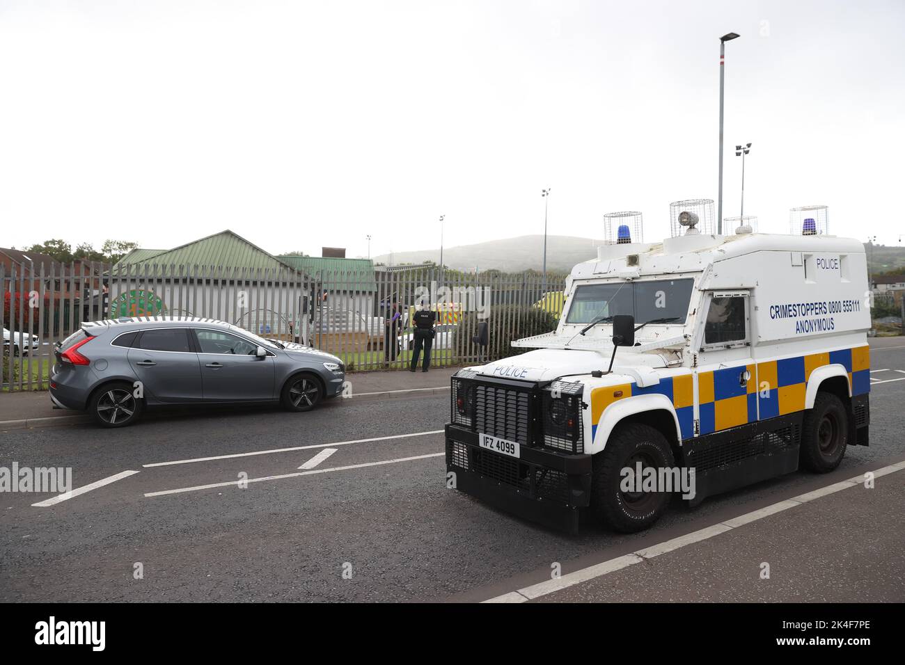 Officers from the PSNI and an armoured vehicle at the scene of a ...